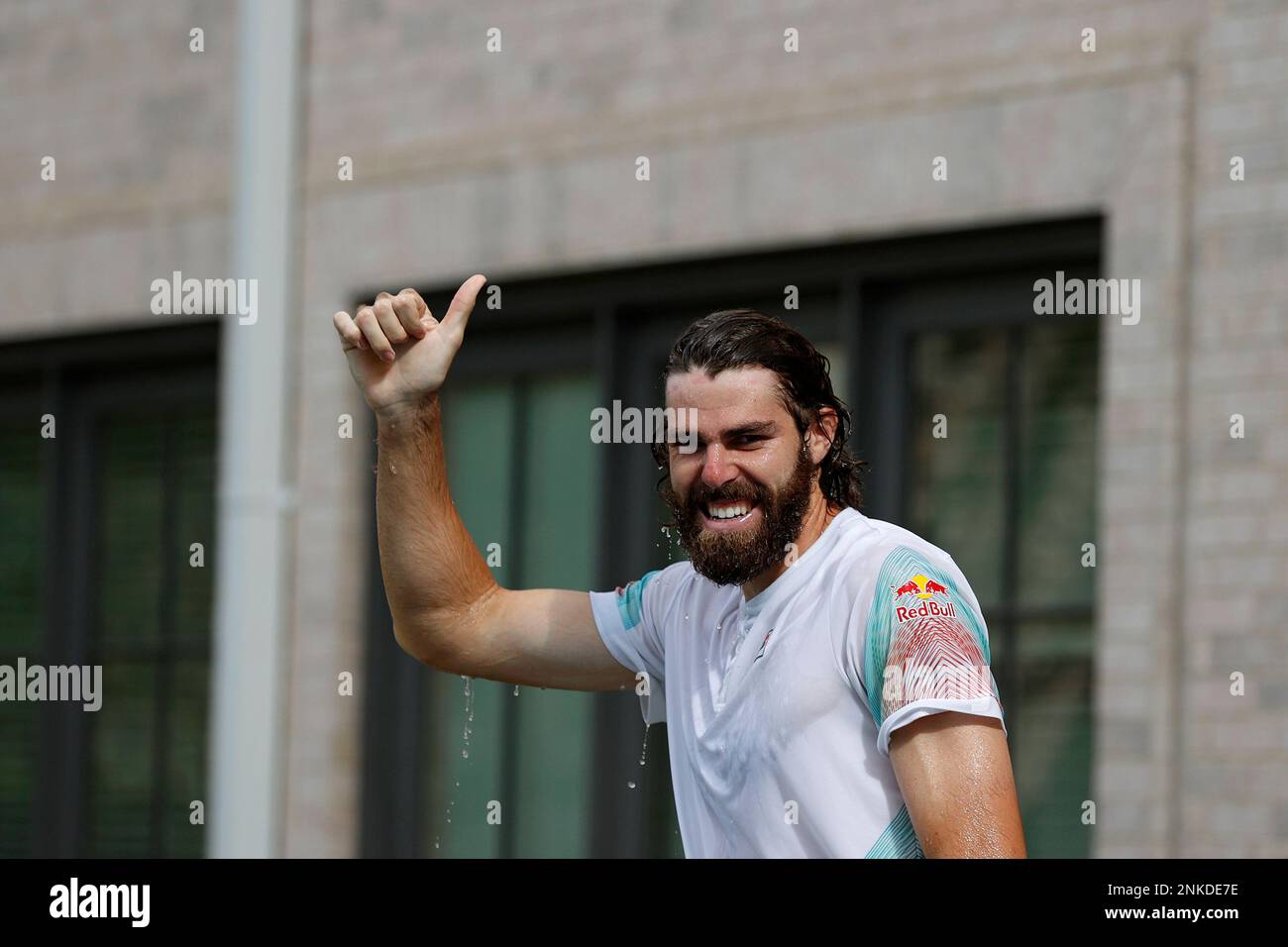 Reilly Opelka, of the United States, gives a thumbs up to the crowd ...
