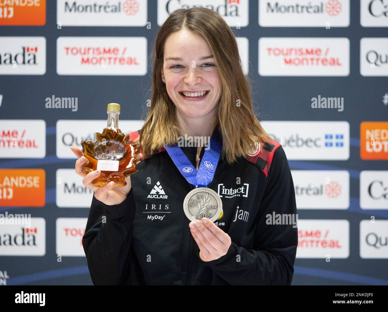 Kim Boutin, of Canada, smiles as she receives her silver medal for the ...
