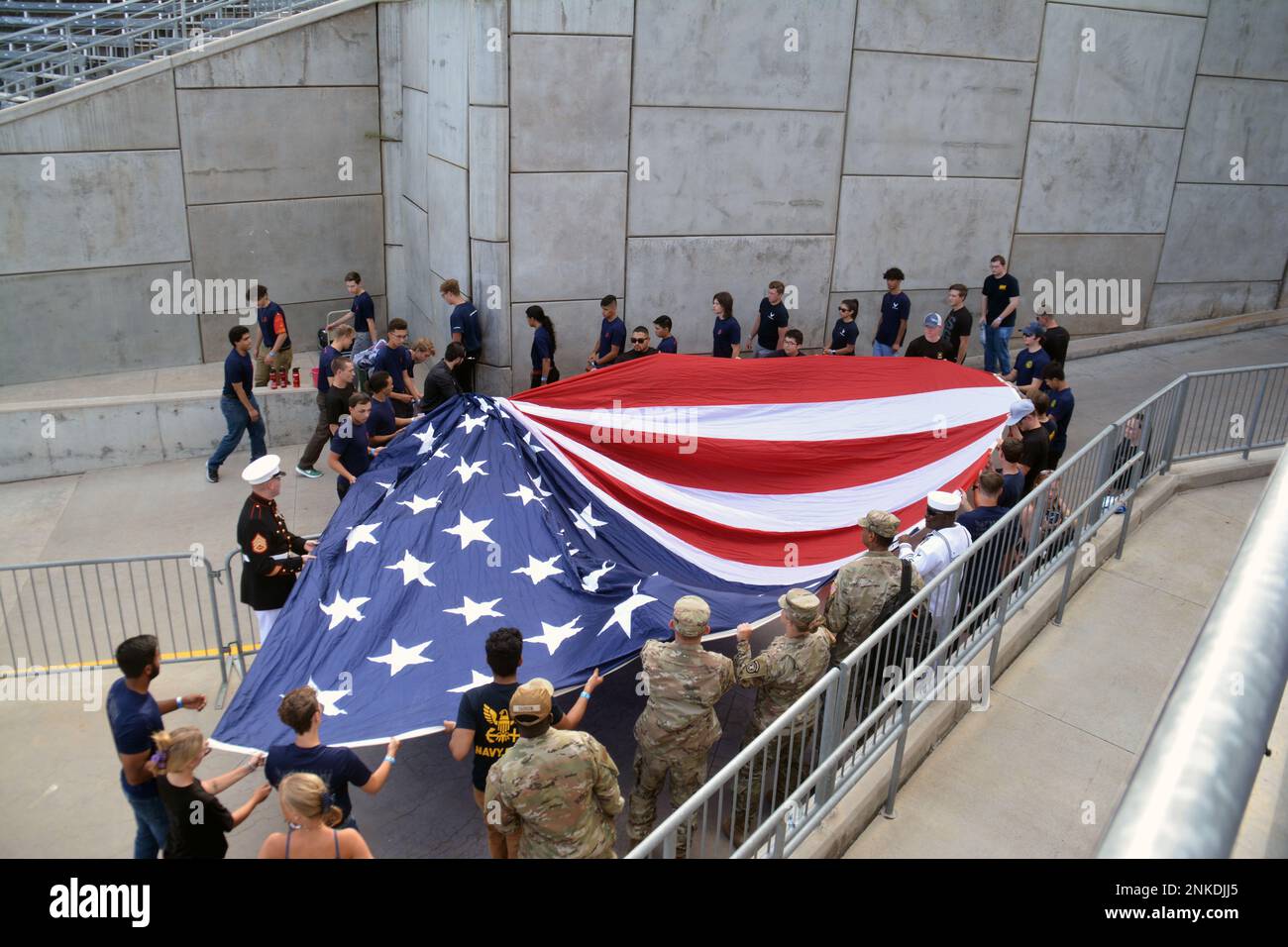 Future Sailors and other future service members unfurl the U.S. Flag ...
