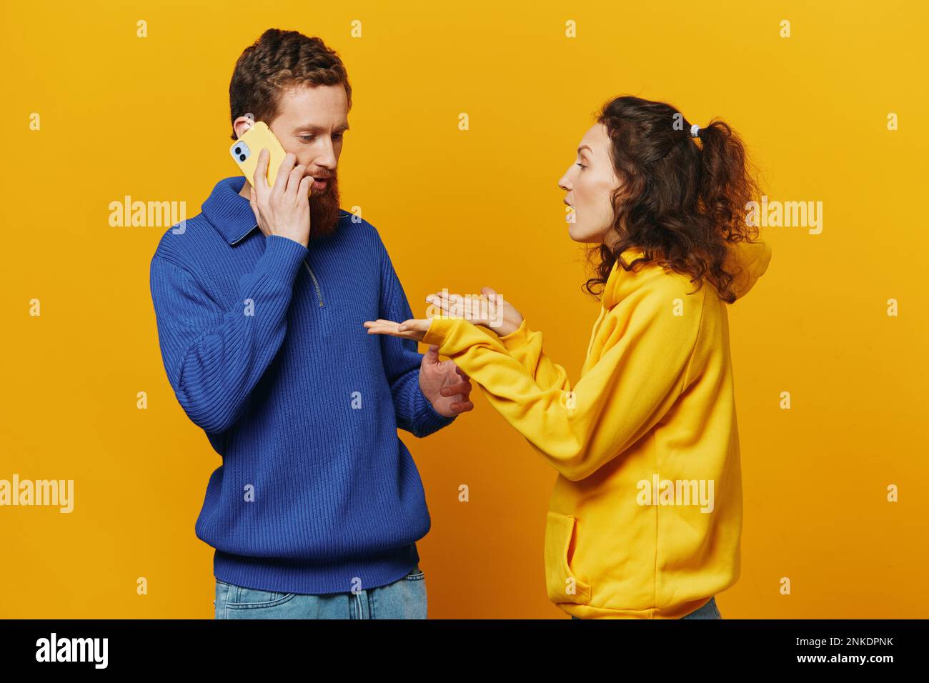 Man and woman couple with phone in hand call talking on the phone, on a ...