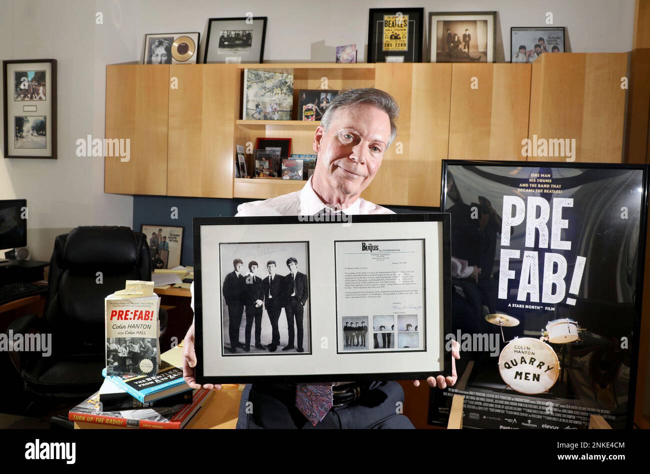 Tampa land use attorney Mark Bentley, 60, holds an autographed 1963 ...