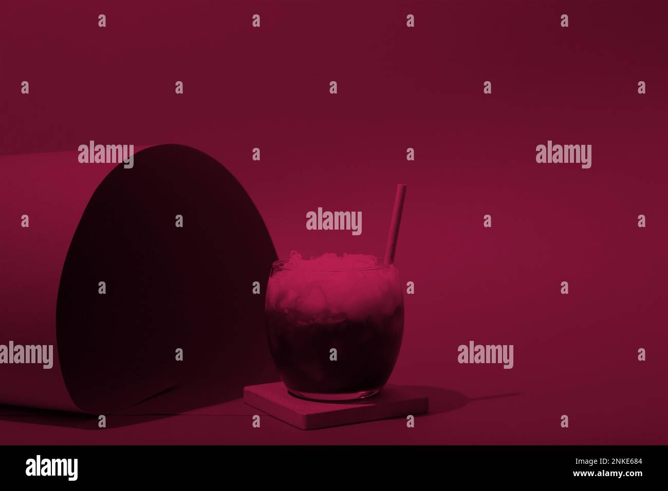 Glass of White Russian cocktail in viva magenta color Stock Photo - Alamy