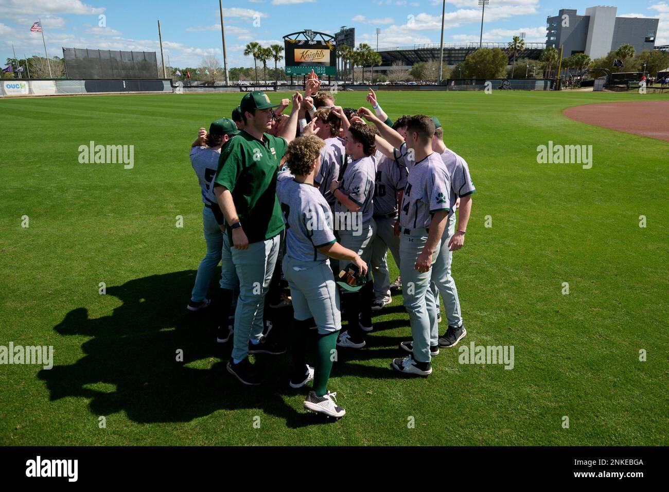 Siena Saints team huddle before an NCAA baseball game against the UCF ...