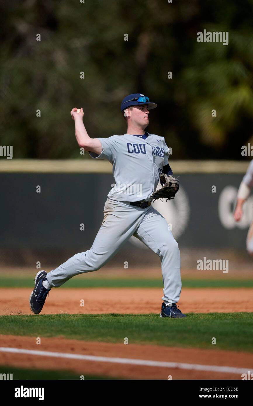 BYU Cougars third baseman Austin Deming (25) throws to first base ...
