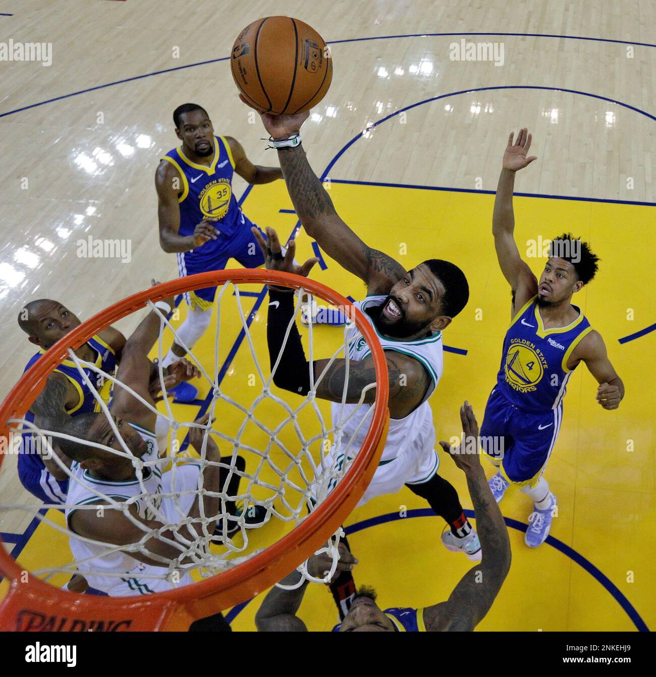 Kyrie Irving (11) puts up a shot in the first half as the Golden State ...