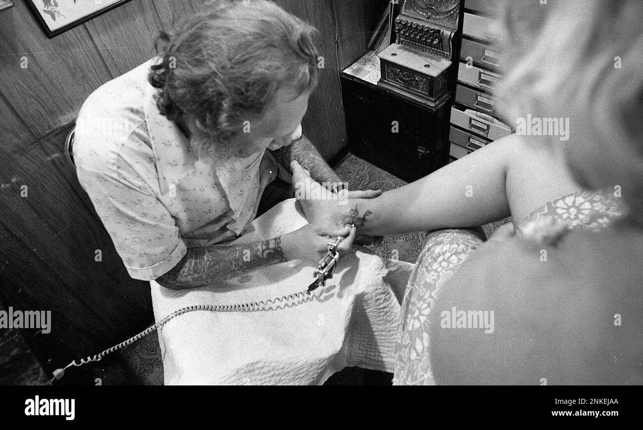 Tattoo artist Lyle Tuttle, at work in his studio, July 23, 1976 (Bill ...