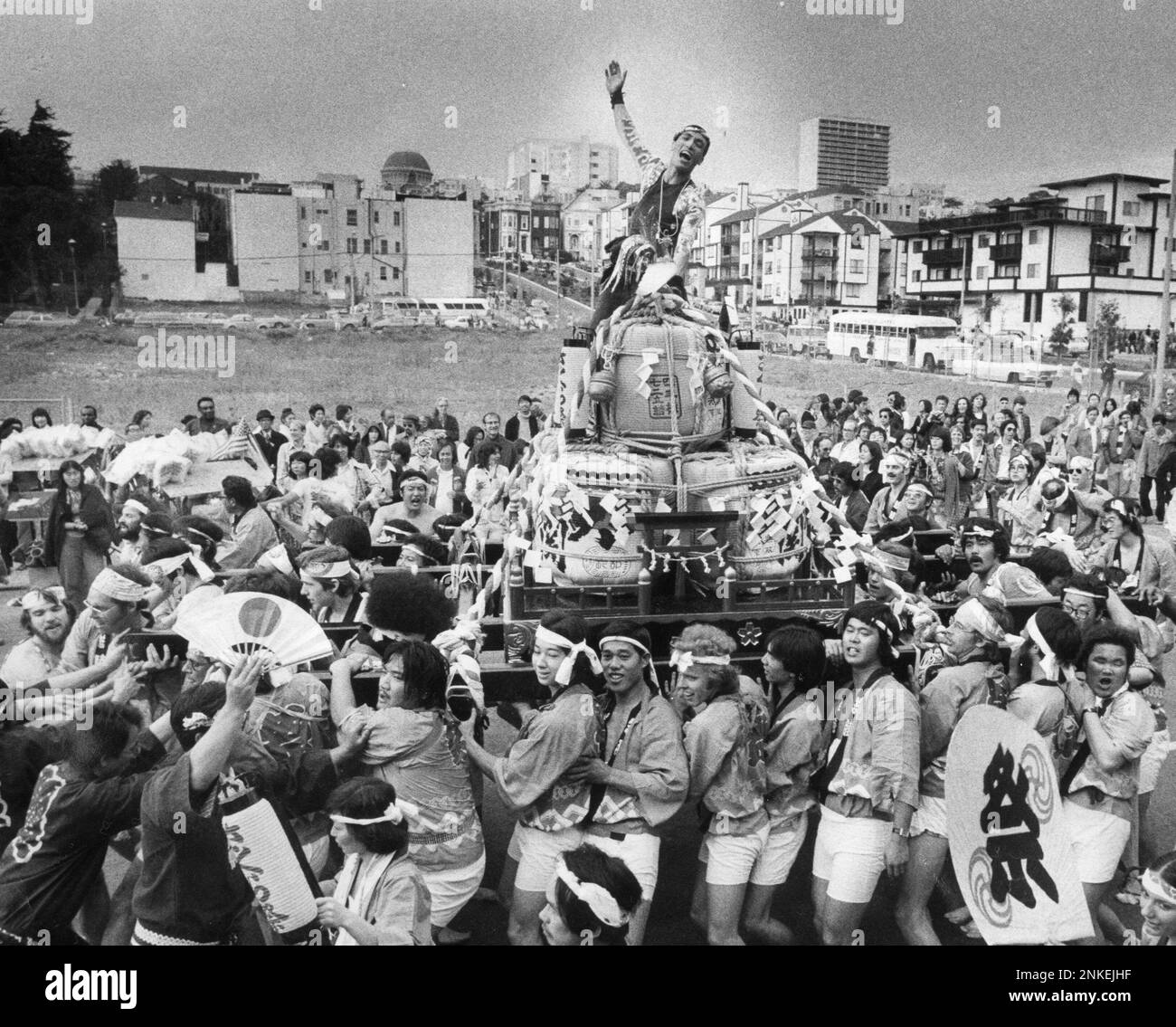 Parade members pull a Sake barrel Shrine (Taru Mikoshi) towards ...