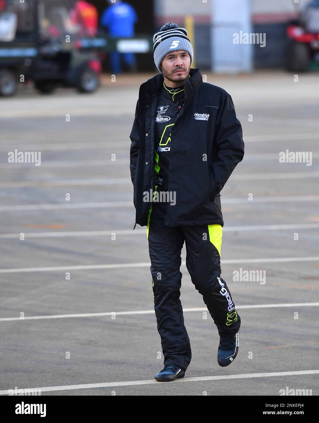 Nascar driver Kyle Larson walks through the infield to his car before ...