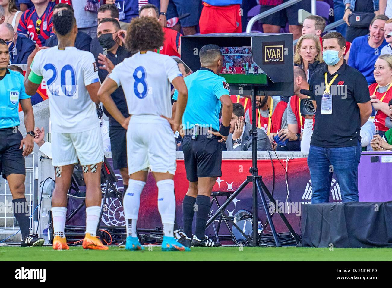 ORLANDO, FL - MARCH 27: The referee reviews a play on the VAR monitor ...