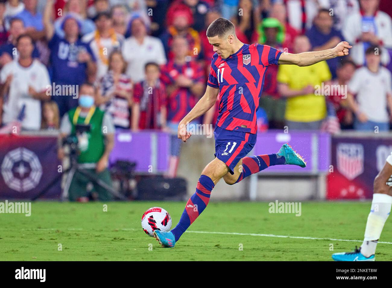 ORLANDO, FL - MARCH 27: United States forward Gio Reyna (11) kicks the ...