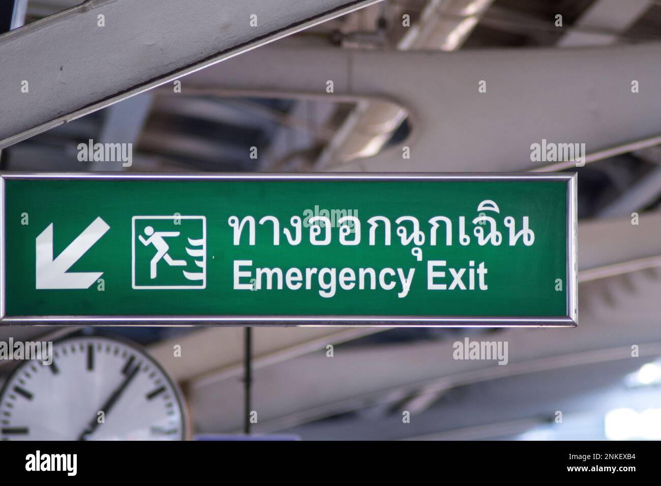 Large Emergency Exit sign with green light box is placed on BTS station ...