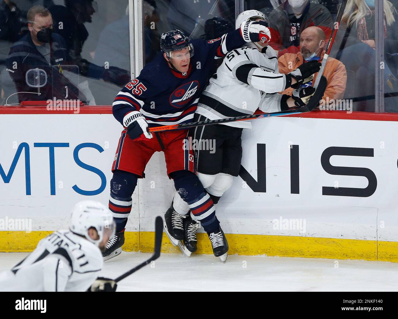 Winnipeg Jets' Paul Stastny (25) checks Los Angeles Kings' Troy Stecher ...