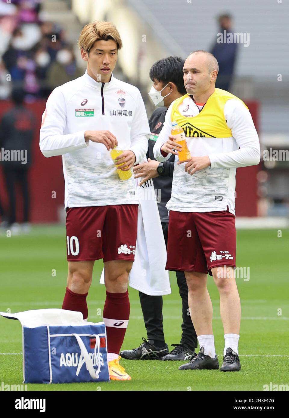 Vissel Kobe's Spanish star Andrés Iniesta (R) and Yuya Osako chat priro ...