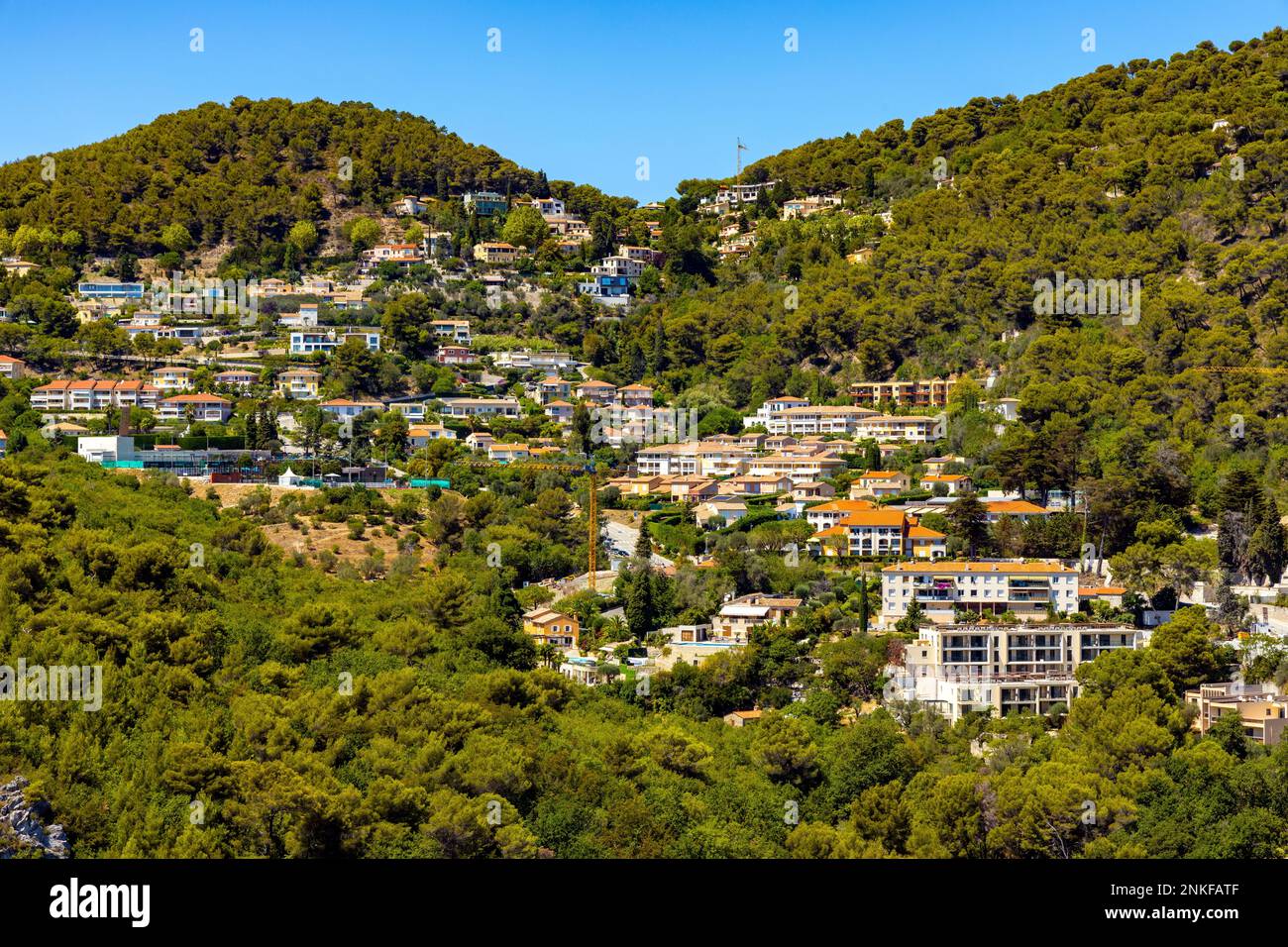 Eze, France - August 1, 2022: Panoramic view of Eze town valley among ...