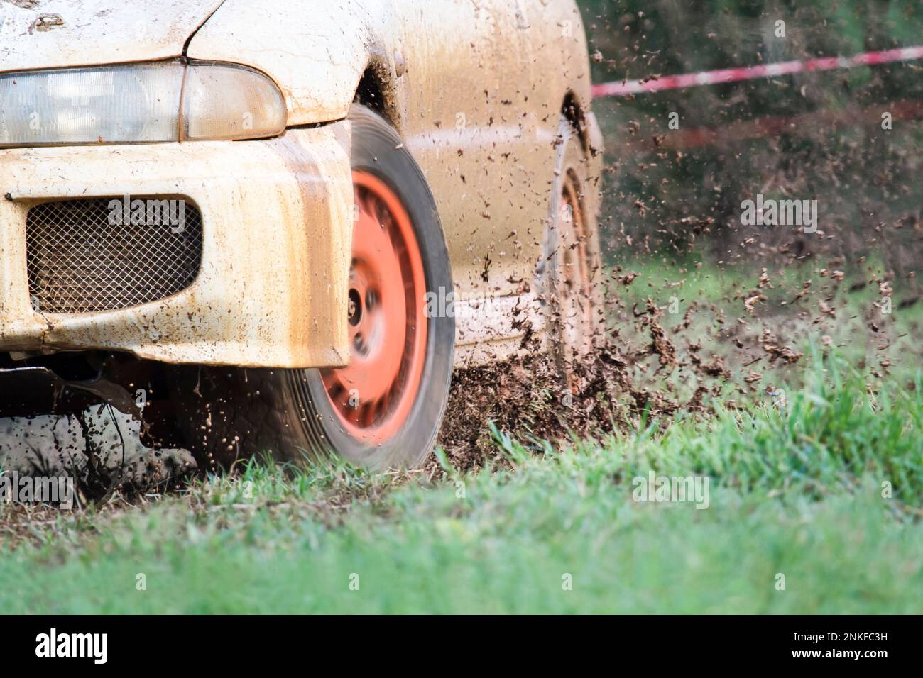 Rally car in muddy road Stock Photo - Alamy