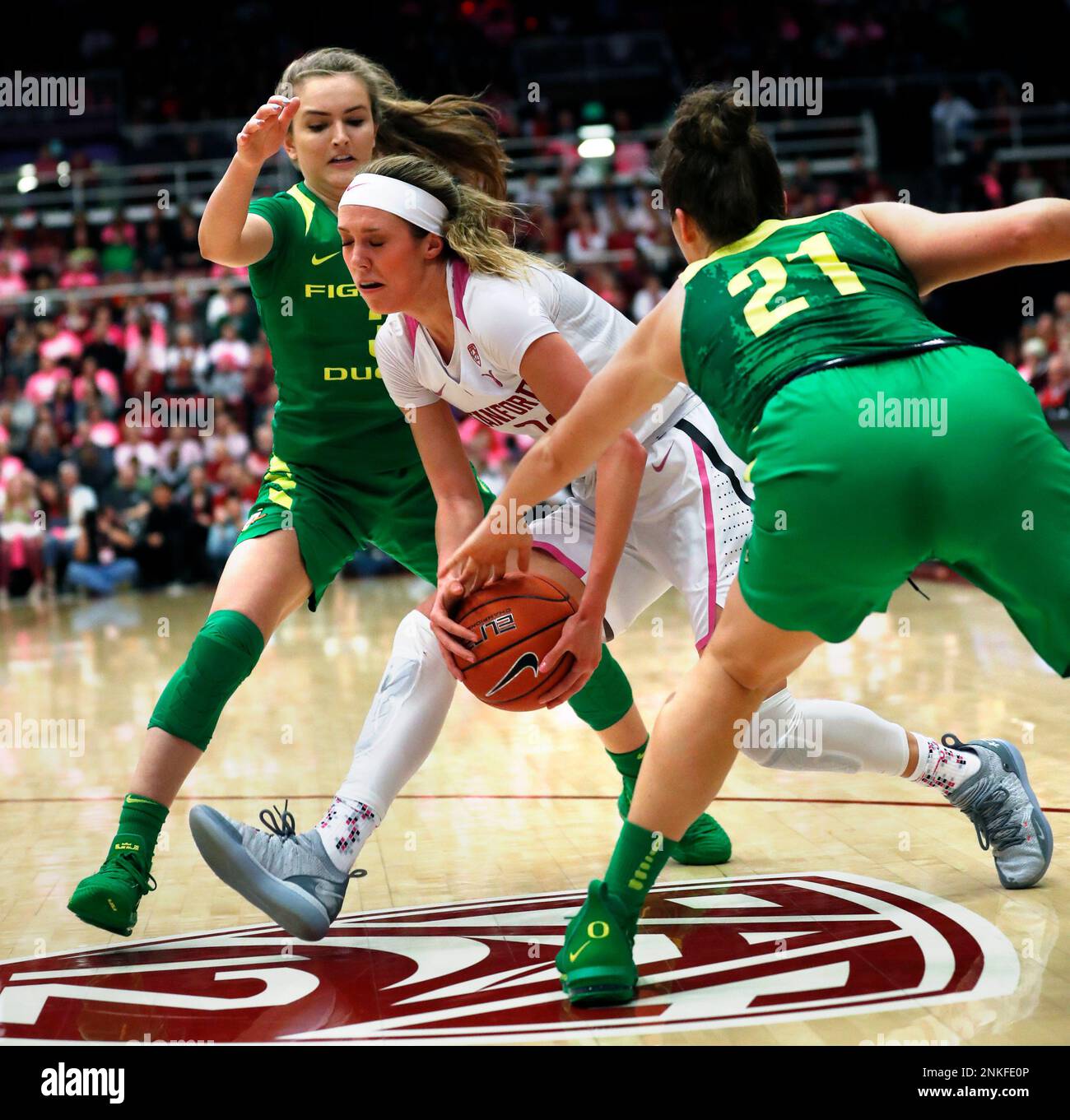 Stanford's Lexie Hall tries to split the defense of Oregon's Erin Boley ...