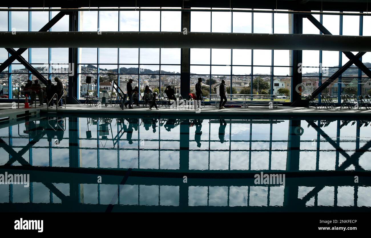 Neighborhood residents arrive for a celebration of the opening of the ...