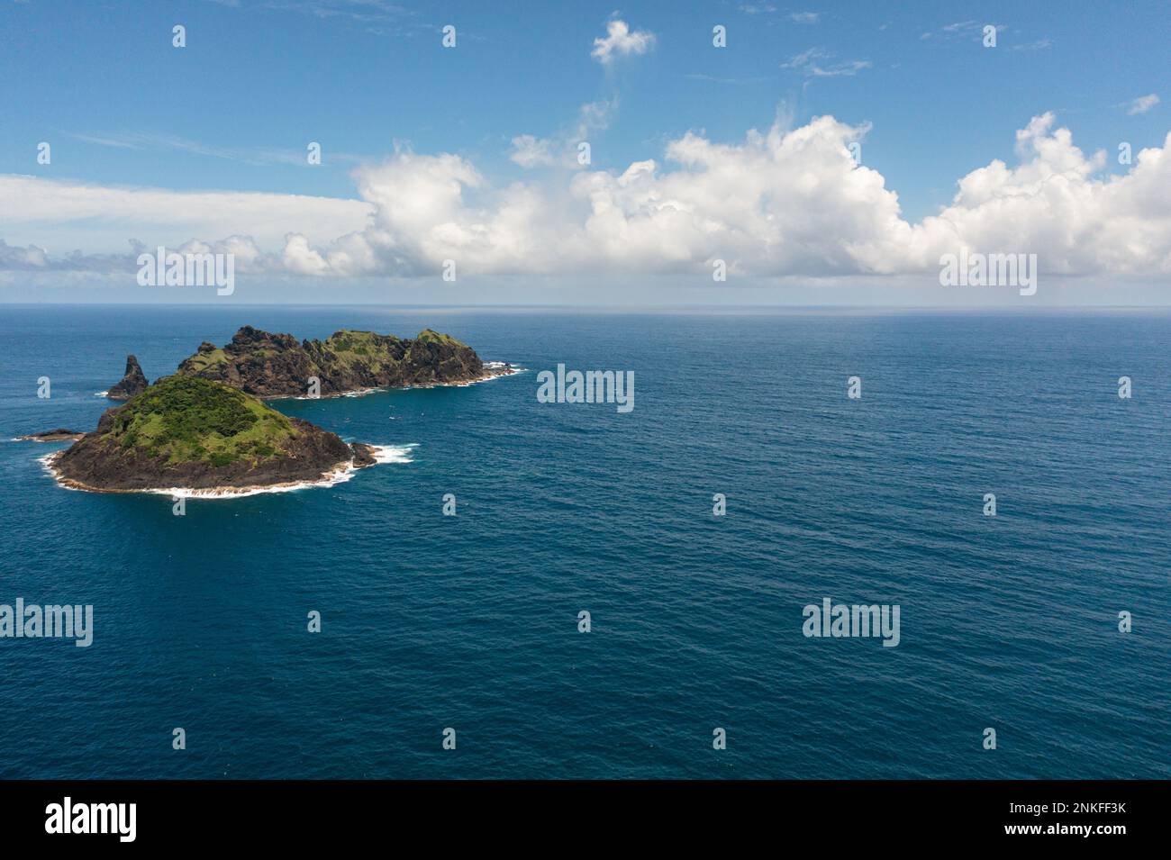 Rocky tropical island in the blue ocean. Dos Hermanos Island. Santa Ana ...