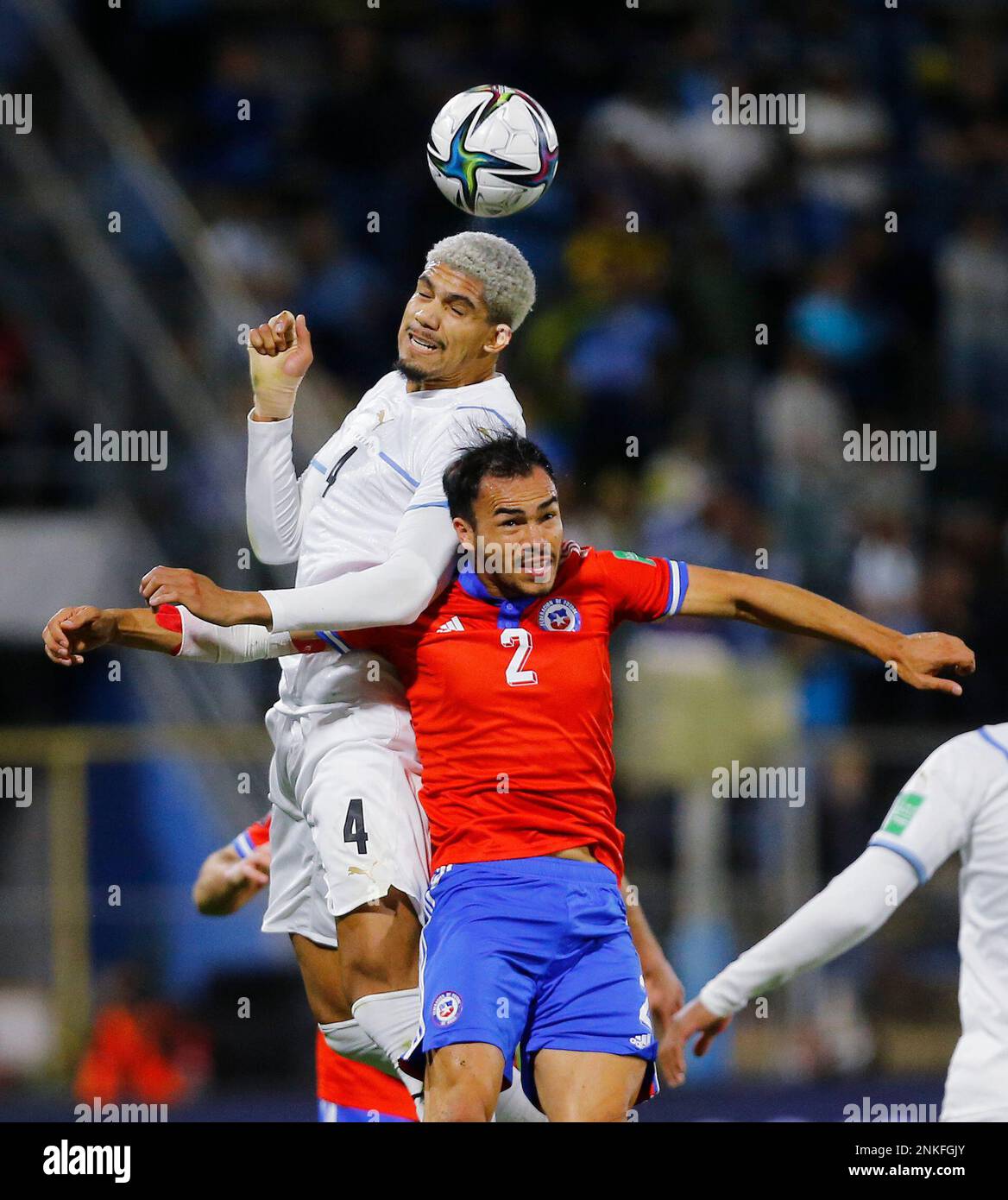 Uruguay's Ronald Araujo, left, and Chile's Gabriel Suazo, go for a ...
