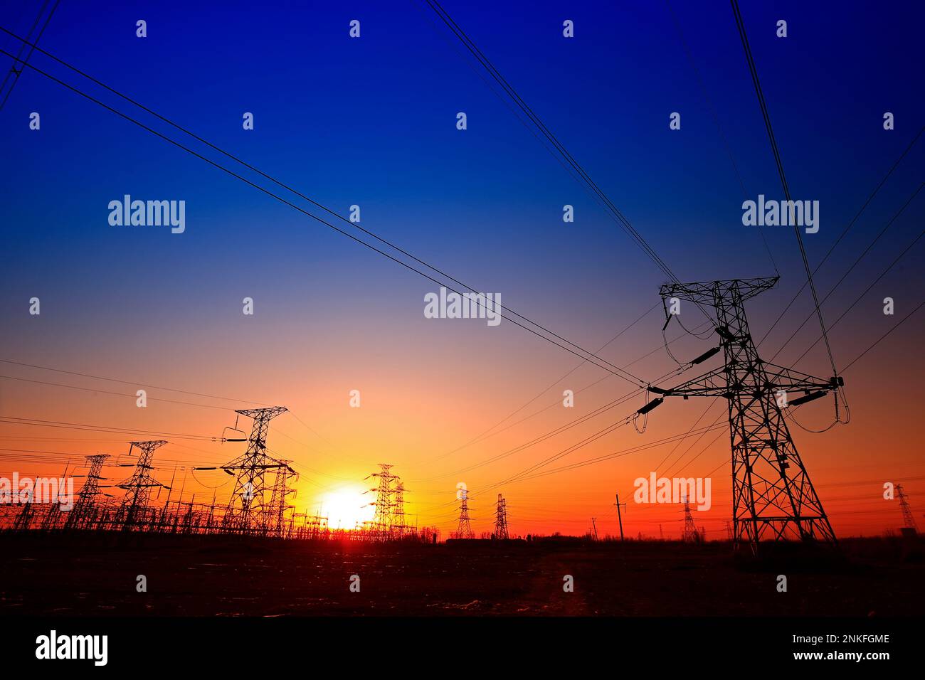 Sunset silhouette of pylon Stock Photo - Alamy