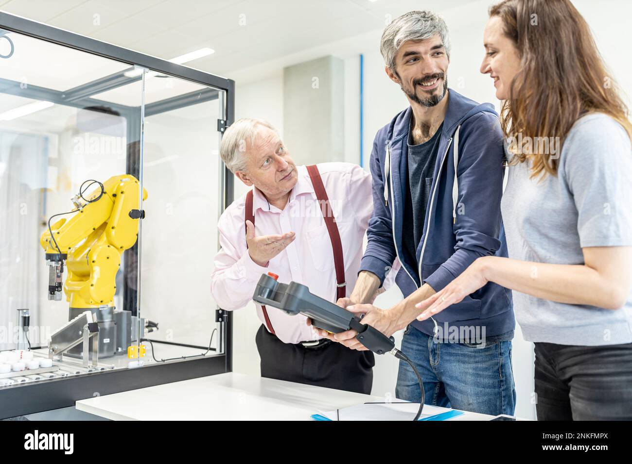 Programming robot hi-res stock photography and images - Alamy