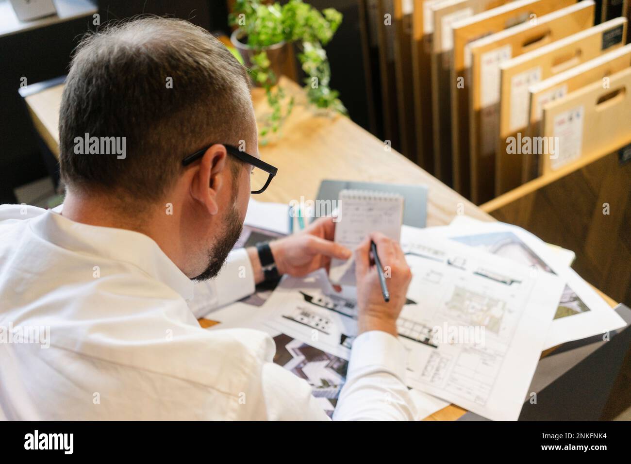 Architect working on project in office Stock Photo - Alamy