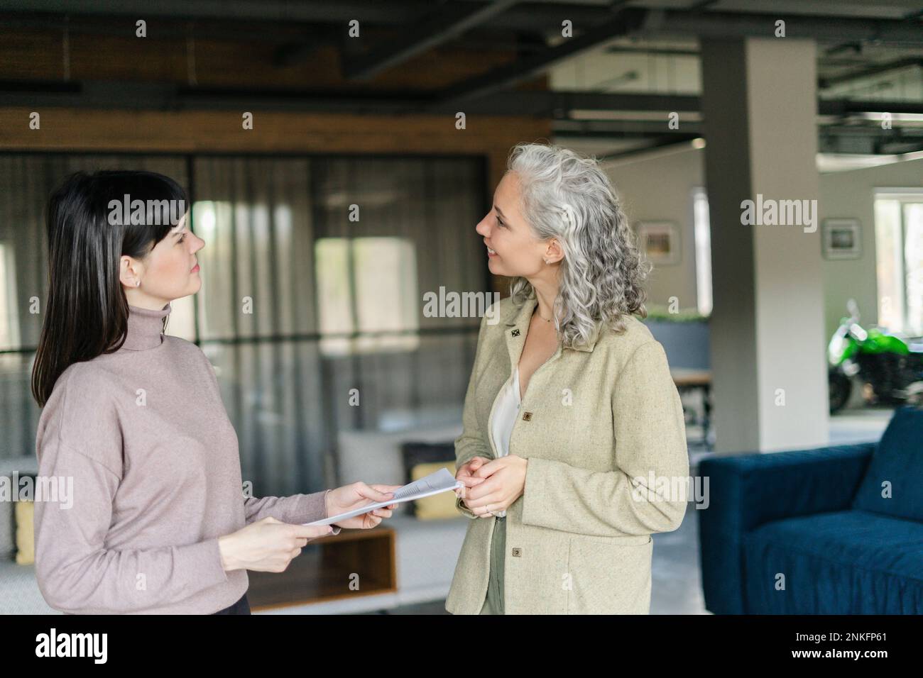 Two People Talking To Each Other Face To Face