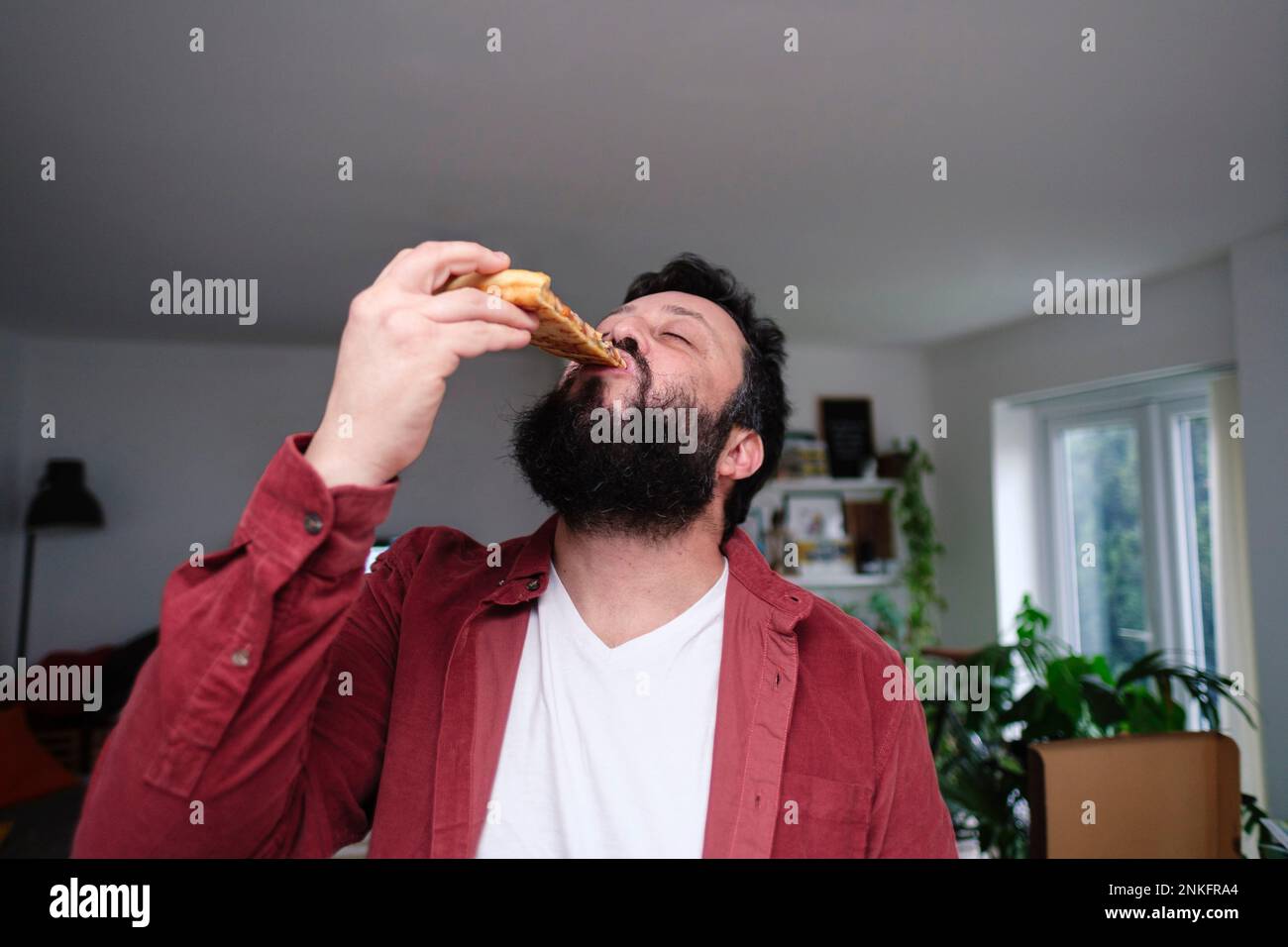 Unhealthy eating man hi-res stock photography and images - Alamy