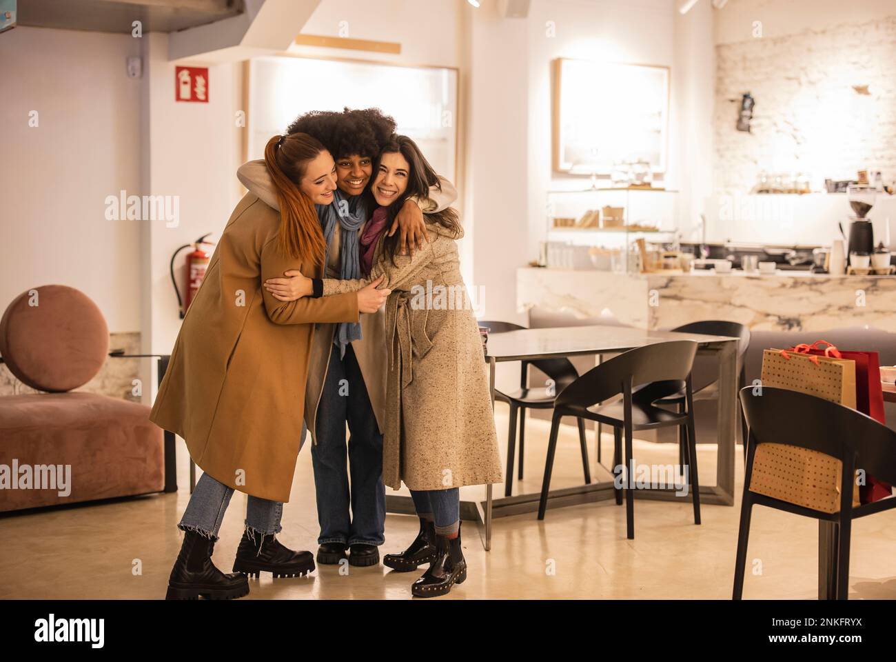 Hugging friends hi-res stock photography and images - Alamy