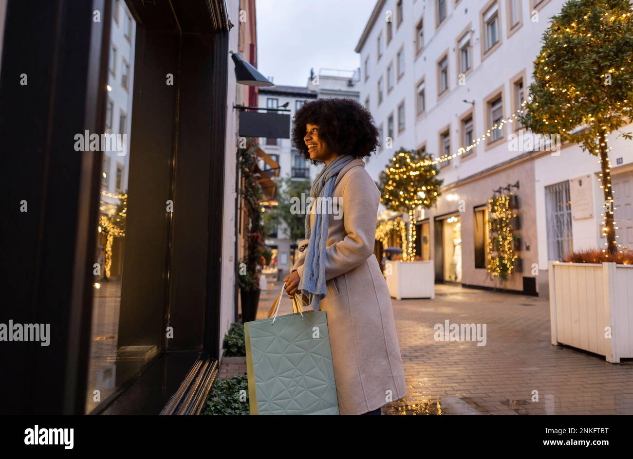 Young happy woman shopping hi-res stock photography and images - Alamy