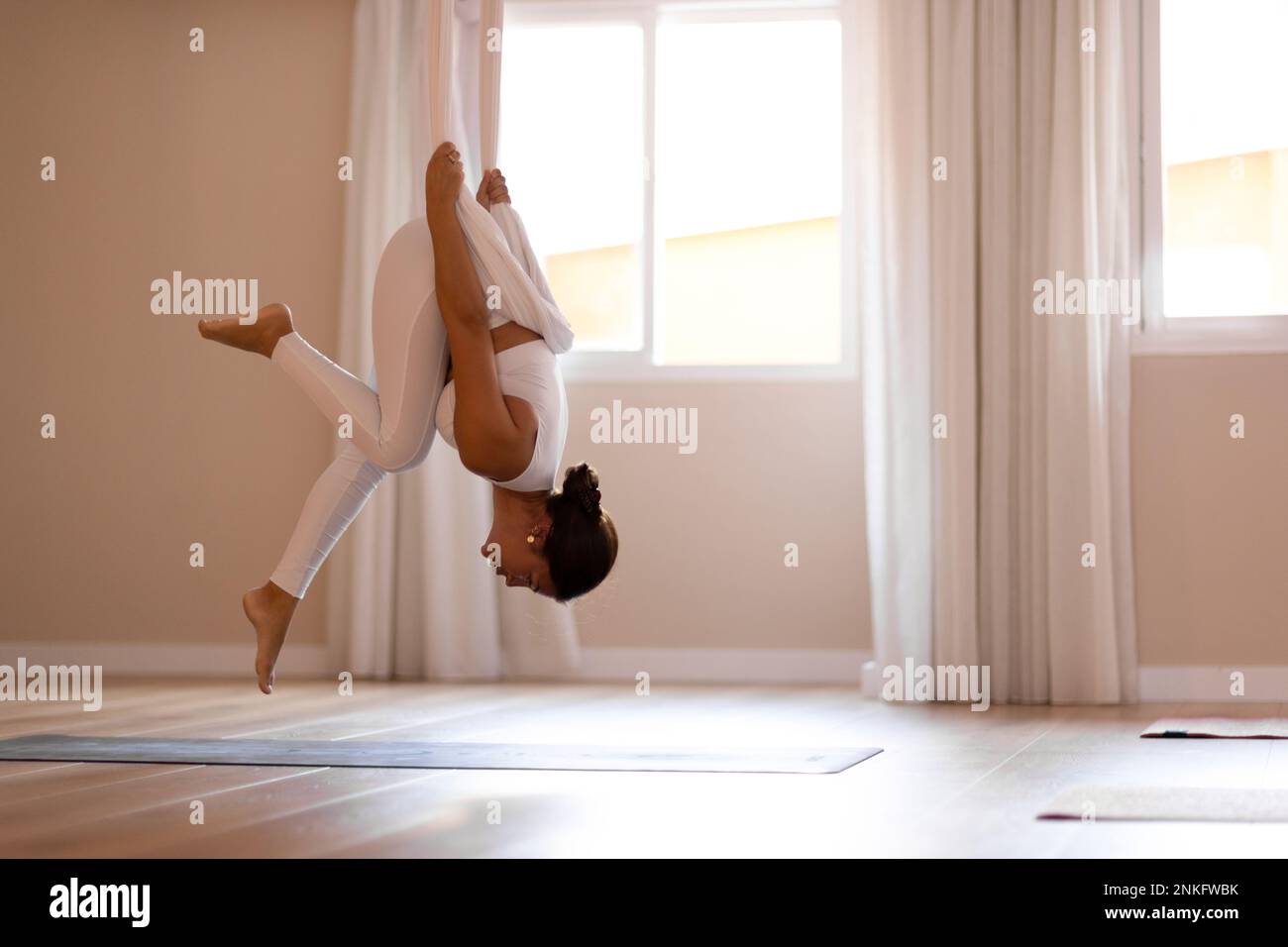 Woman doing exercise hammock hi-res stock photography and images - Alamy