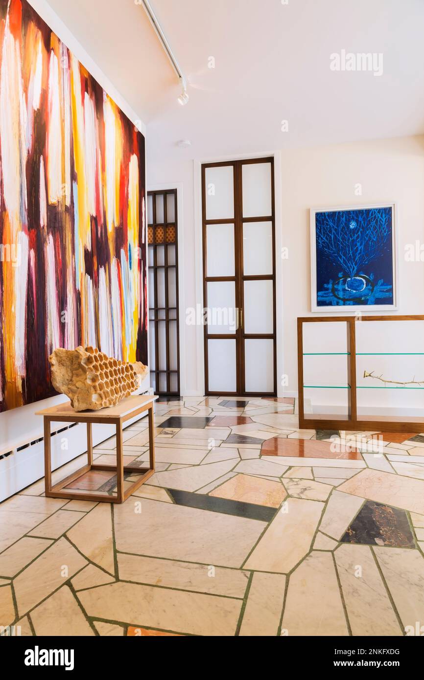 Entryway with nuanced mosaic marble floor inside contemporary home ...