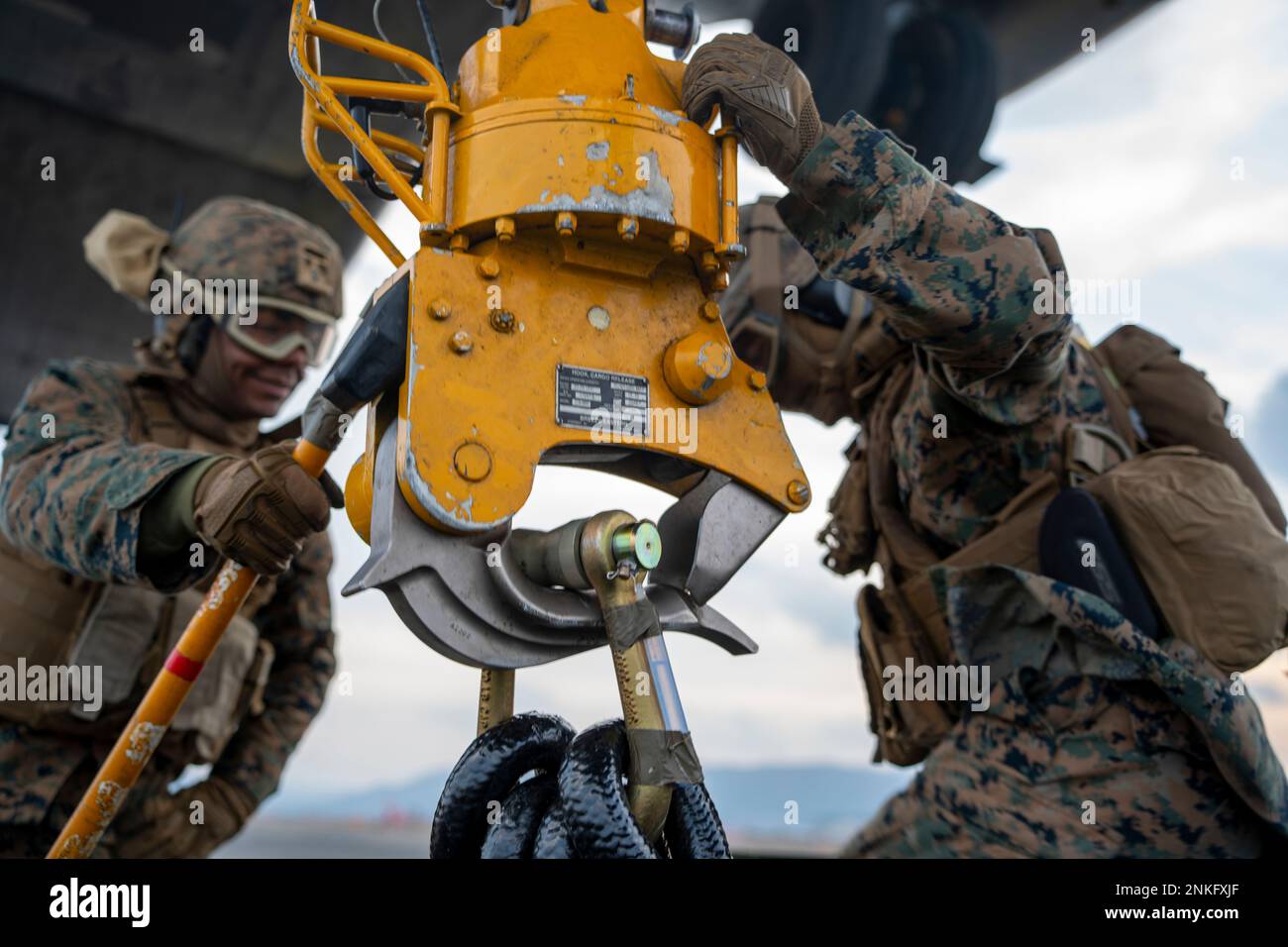 U.S. Marines with Combat Logistics Battalion 31, connect a Humvee to a ...
