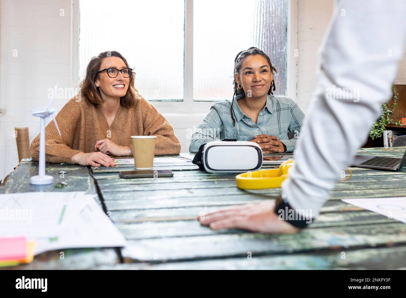 Professional coworkers having discussion hi-res stock photography and ...