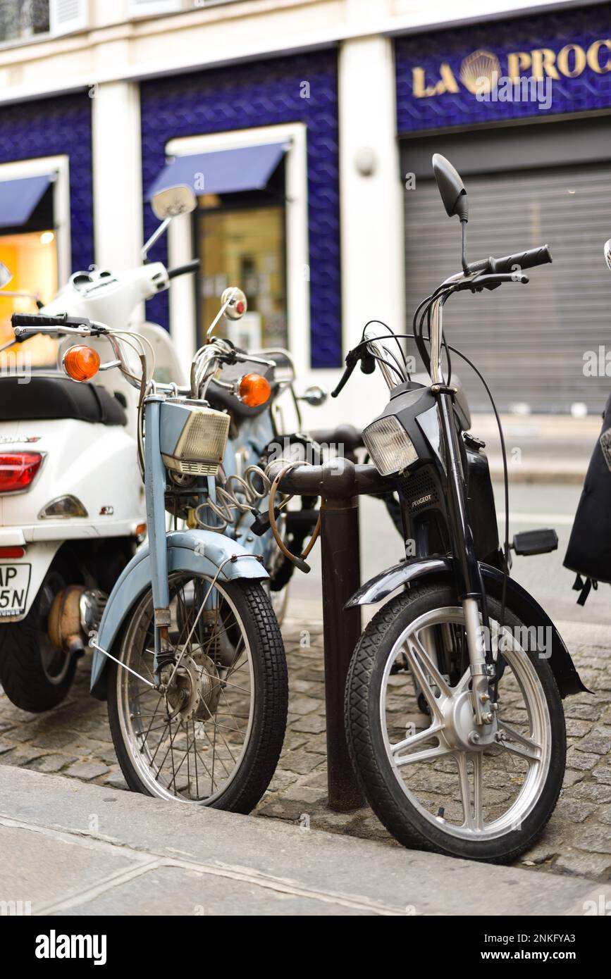 Two Mopeds Looking at Each Other Lovingly in Paris, France Stock Photo ...