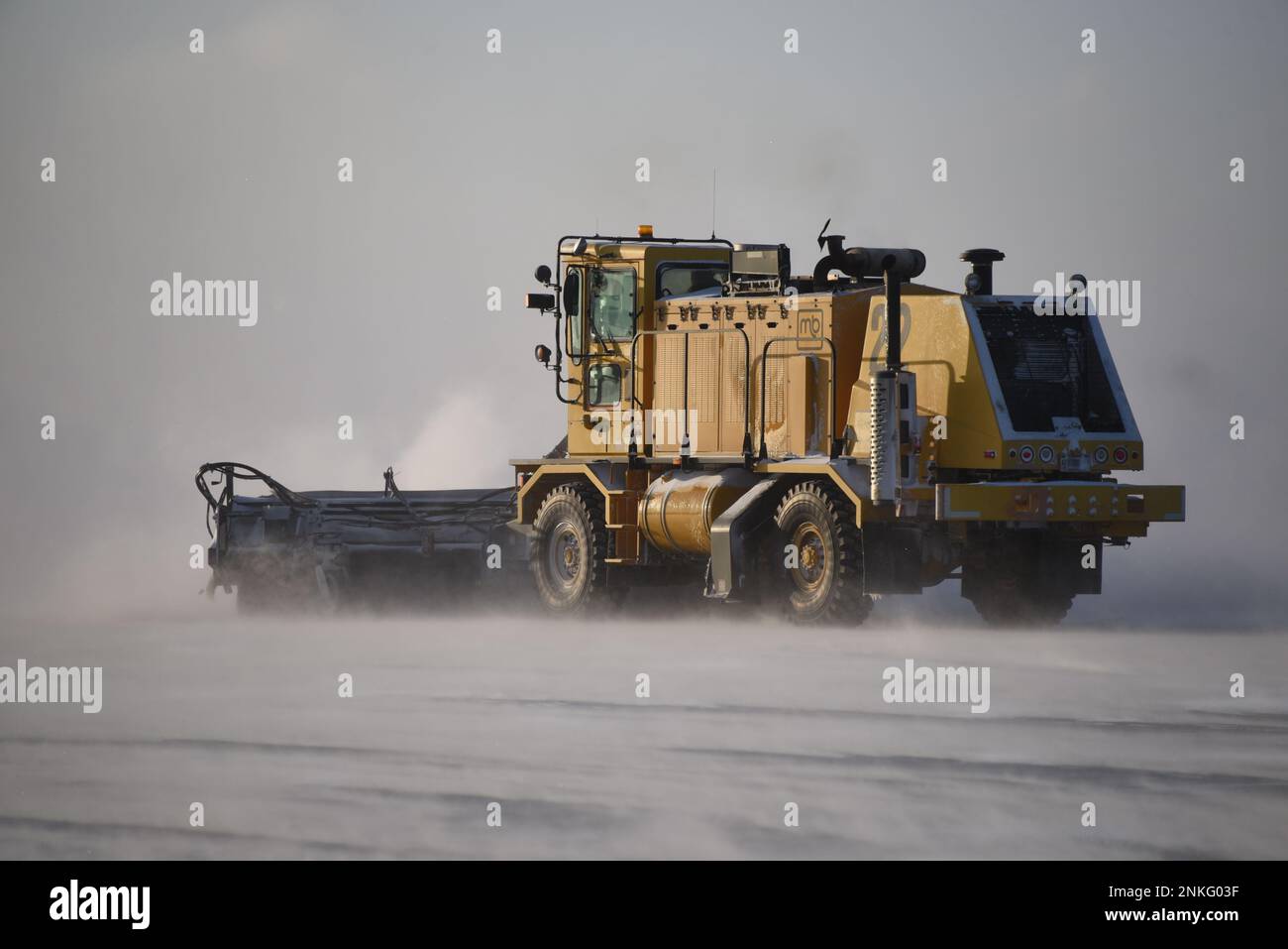 A snow removal vehicle becomes lost in a cloud of wind whipped snow ...