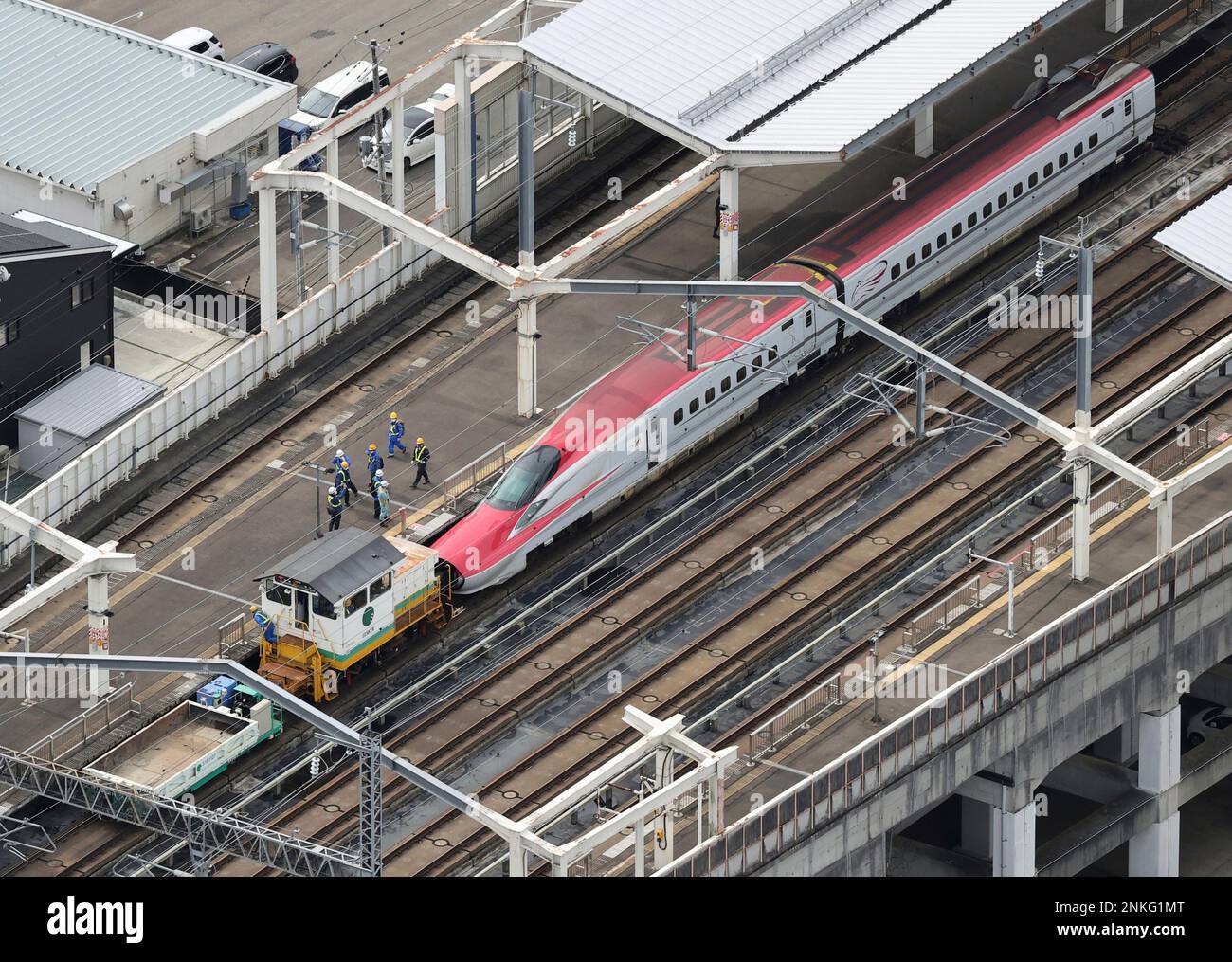 An aerial photo shows cars of derailed Shinkansen bullet train been ...