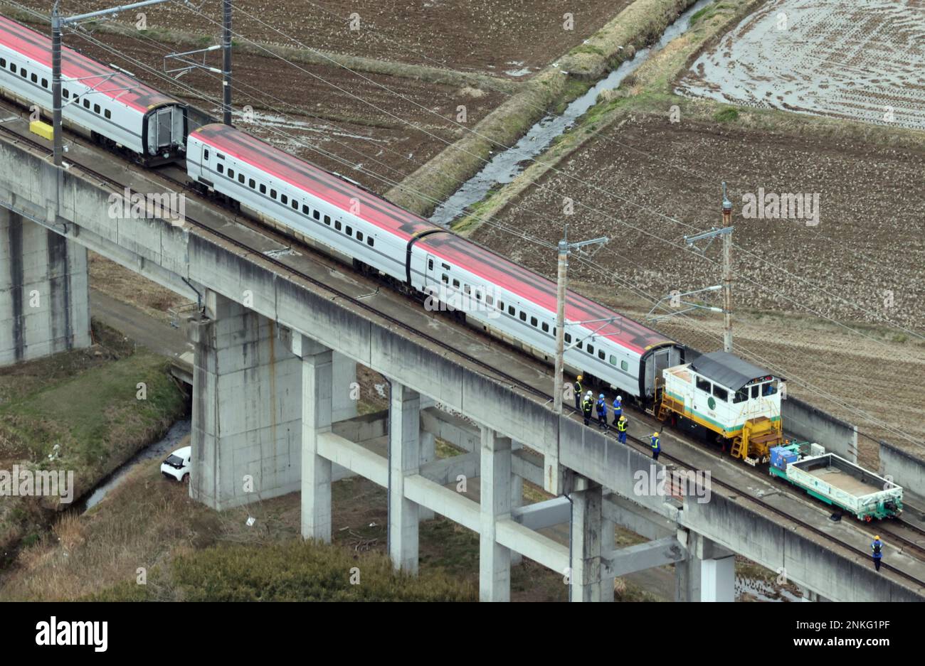 An aerial photo shows cars of derailed Shinkansen bullet train been ...