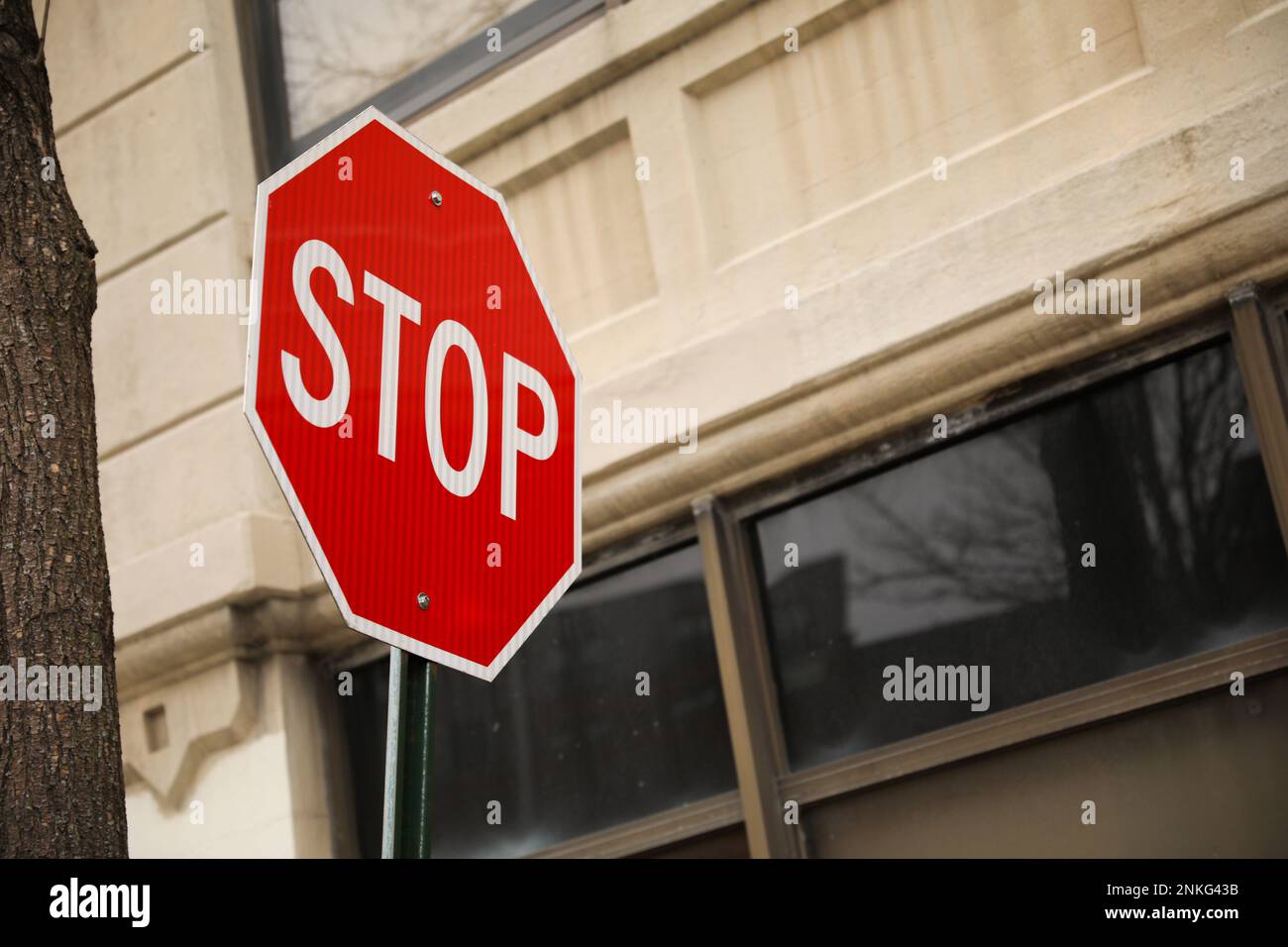 Stop sign in public road warning at intersection and law and order ...