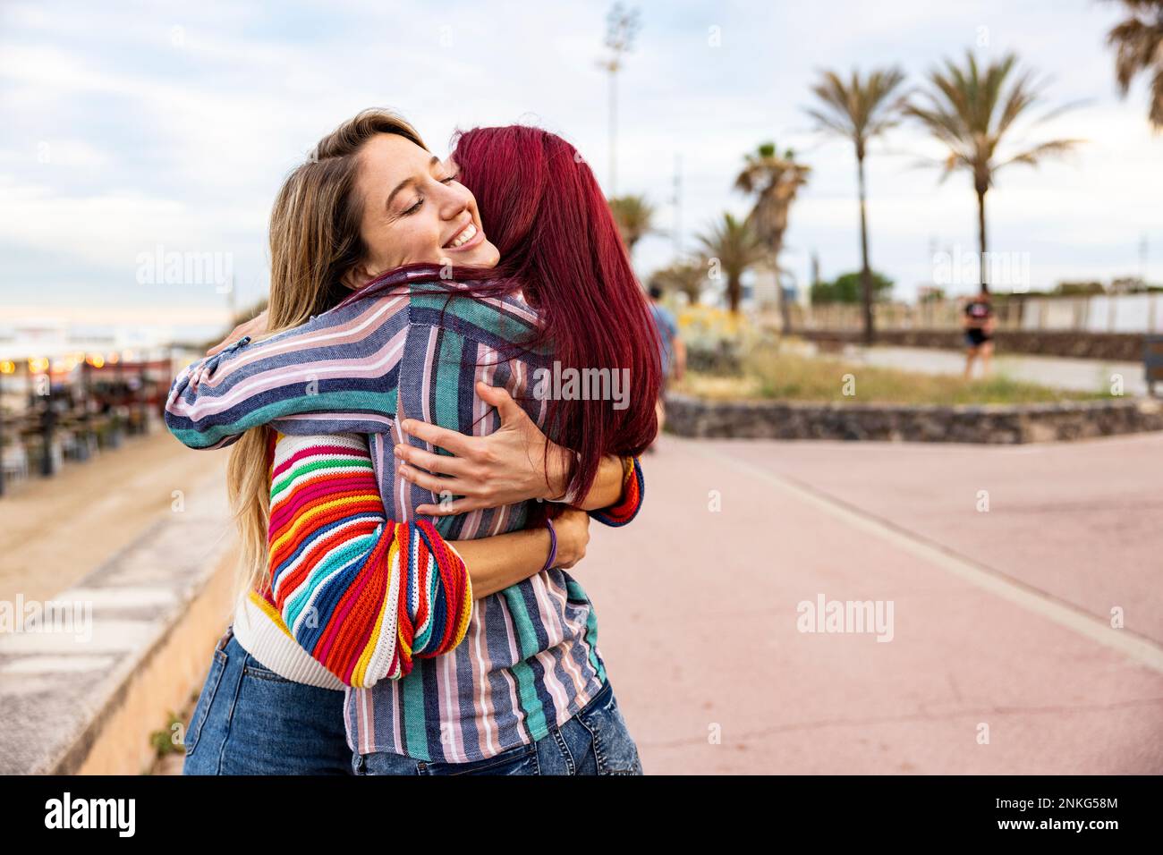Three people hugging other hi-res stock photography and images - Alamy