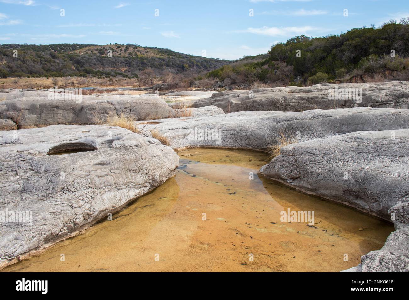 Limestone formations pools capture water puddles in Pedernales Falls ...