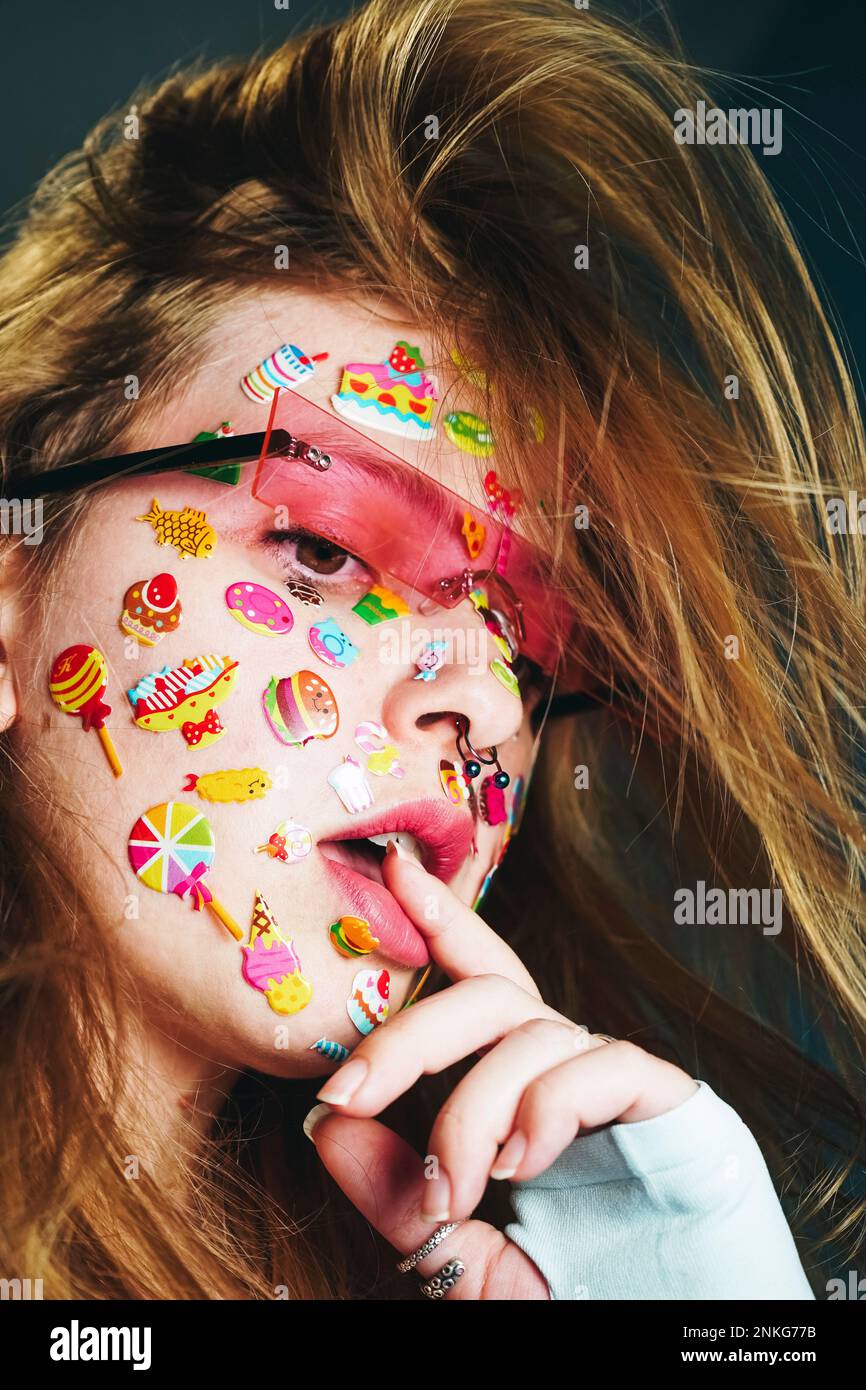 Woman with stickers on her face hi-res stock photography and images - Alamy