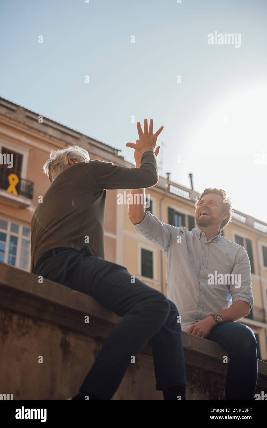 Happy high five mature hi-res stock photography and images - Alamy
