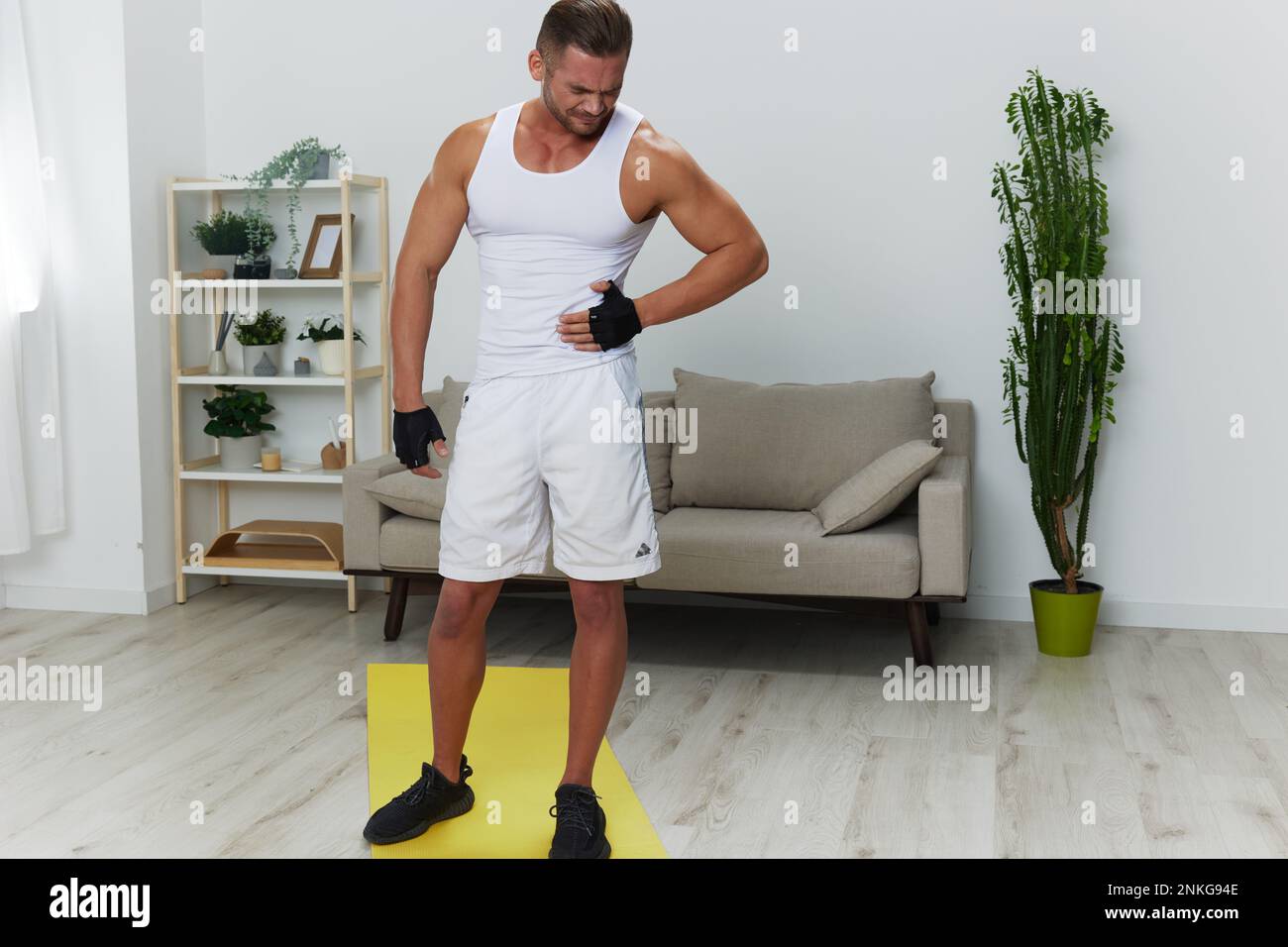 Male bodybuilder flexing muscles side hi-res stock photography and ...