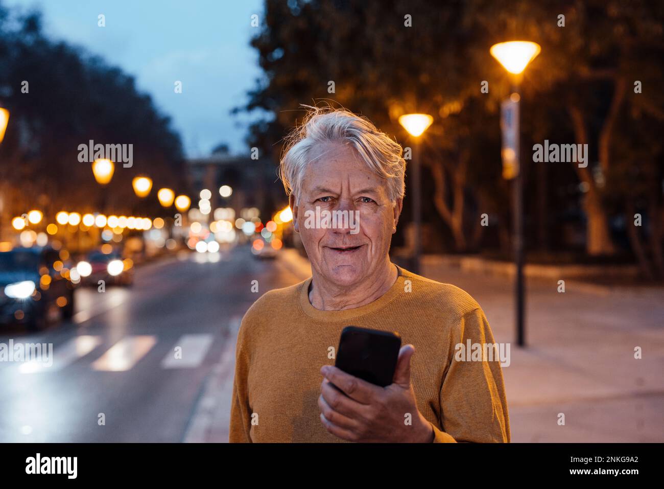 Happy senior man standing on hi-res stock photography and images - Alamy