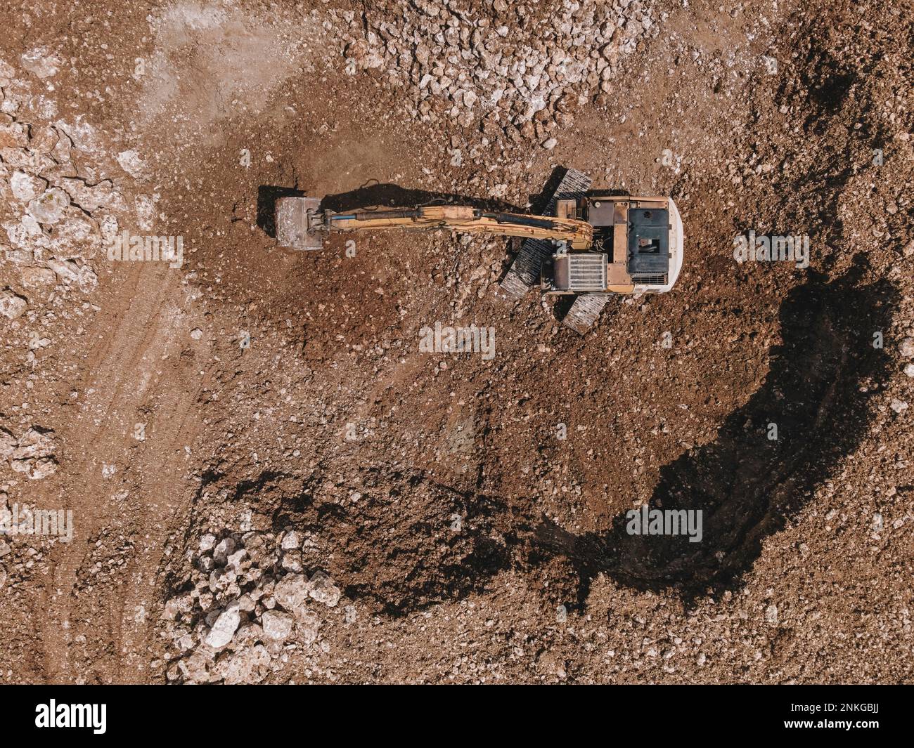 Indonesia, Bali, Aerial view of excavator digging in quarry Stock Photo ...