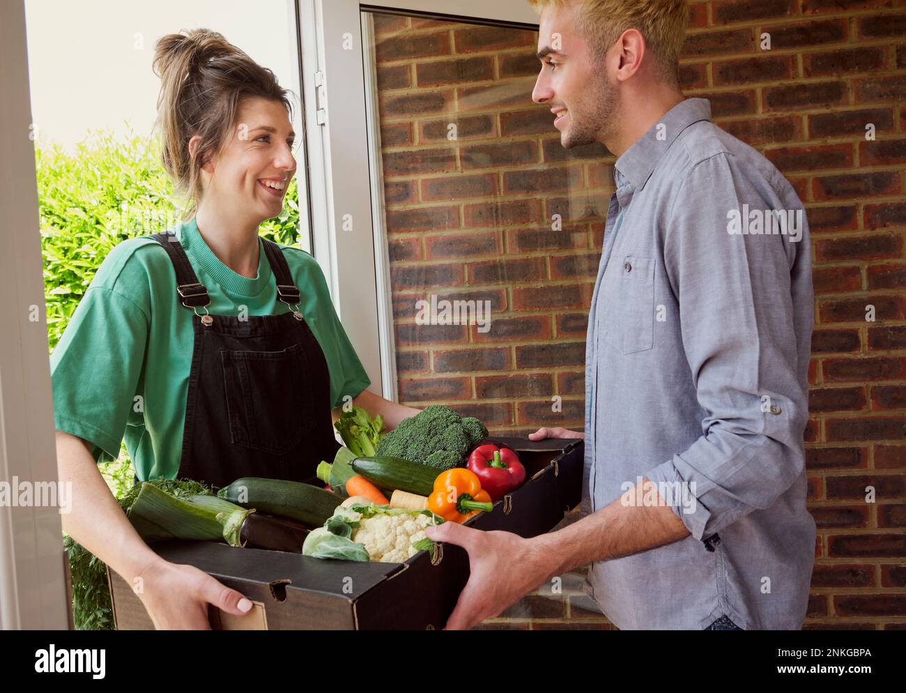 Person delivering vegetable box hi-res stock photography and images - Alamy