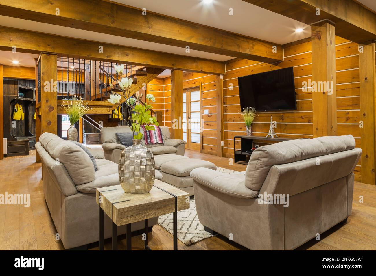 Beige suede sofas, love seat and ottomans in family room with thick ...