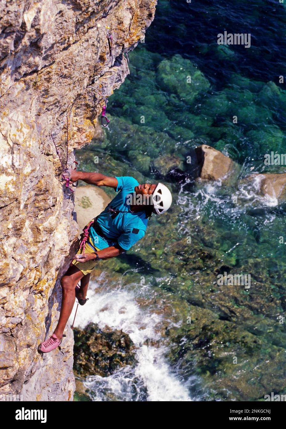 Man climbing mountain with river in Pembrokeshire, Wales Stock Photo ...