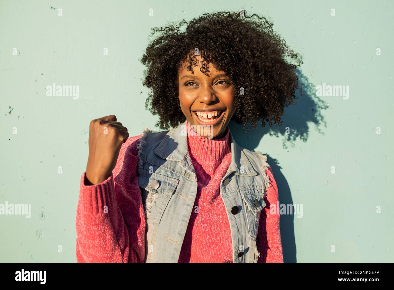 Curly woman cheering hi-res stock photography and images - Alamy